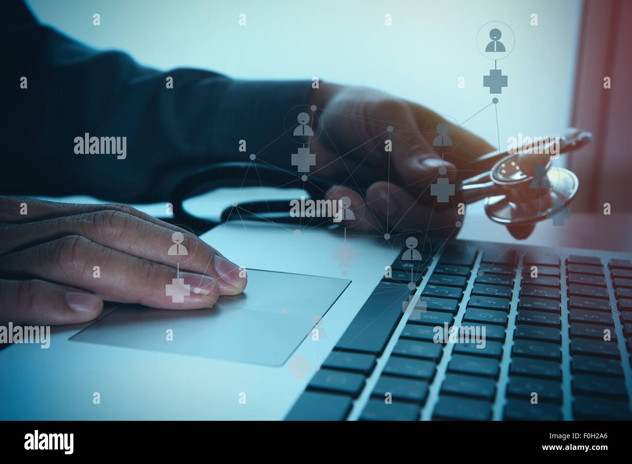 Doctor hand working with laptop computer in medical workspace office as ...