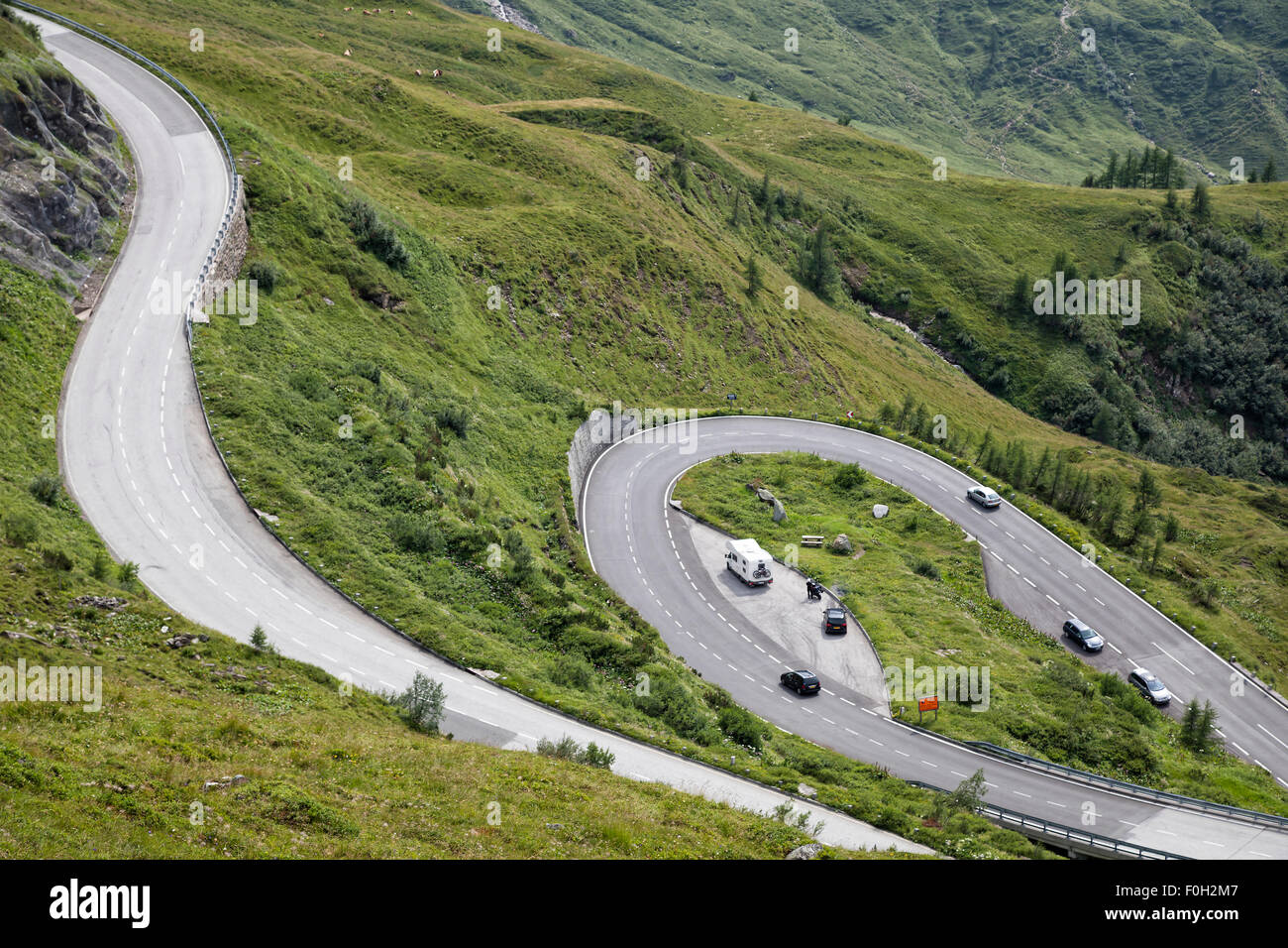Alpine road, car speeding, Eastern Alps Stock Photo - Alamy