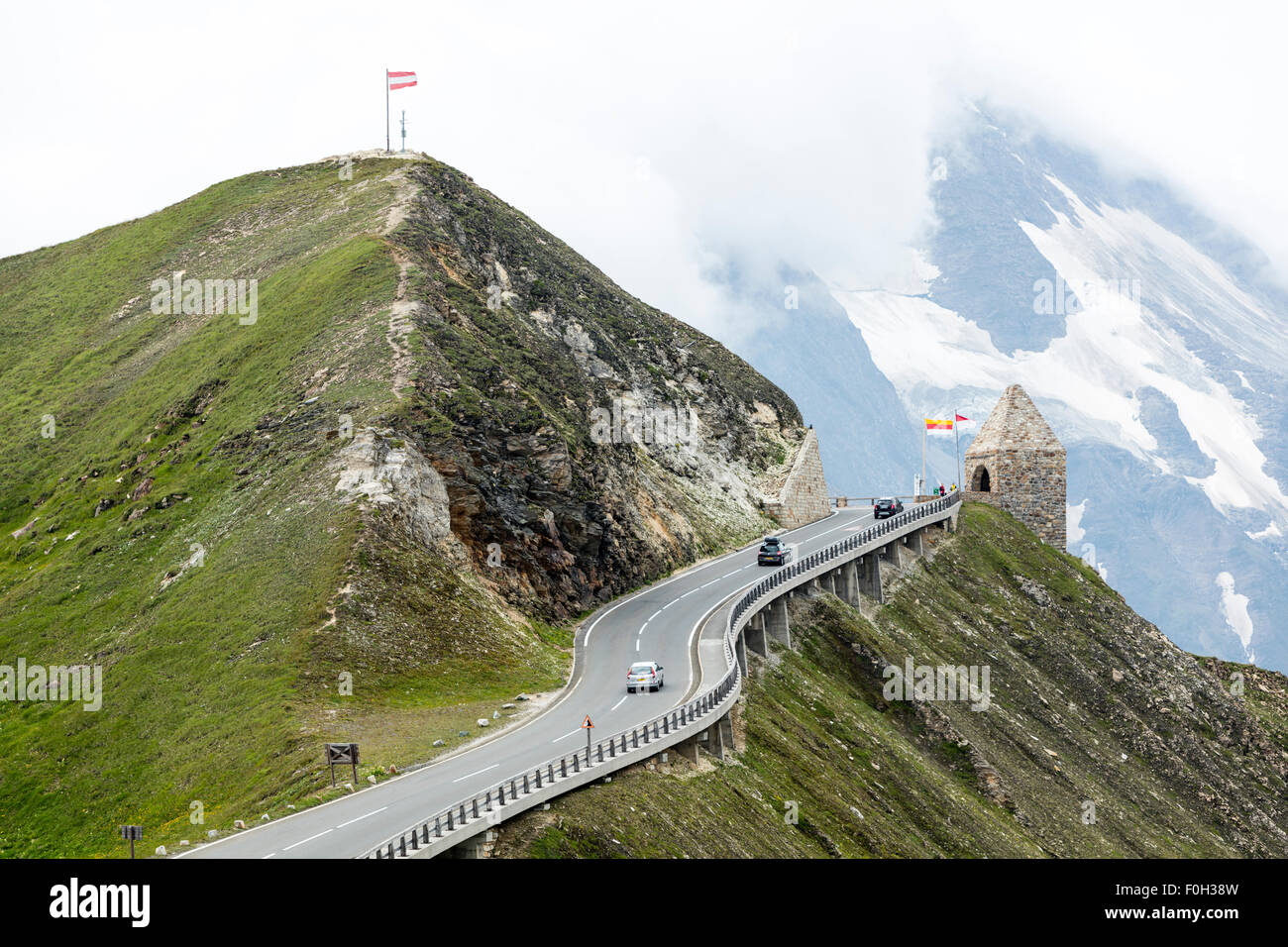 Alpine road, cars speeding, Eastern Alps Stock Photo - Alamy