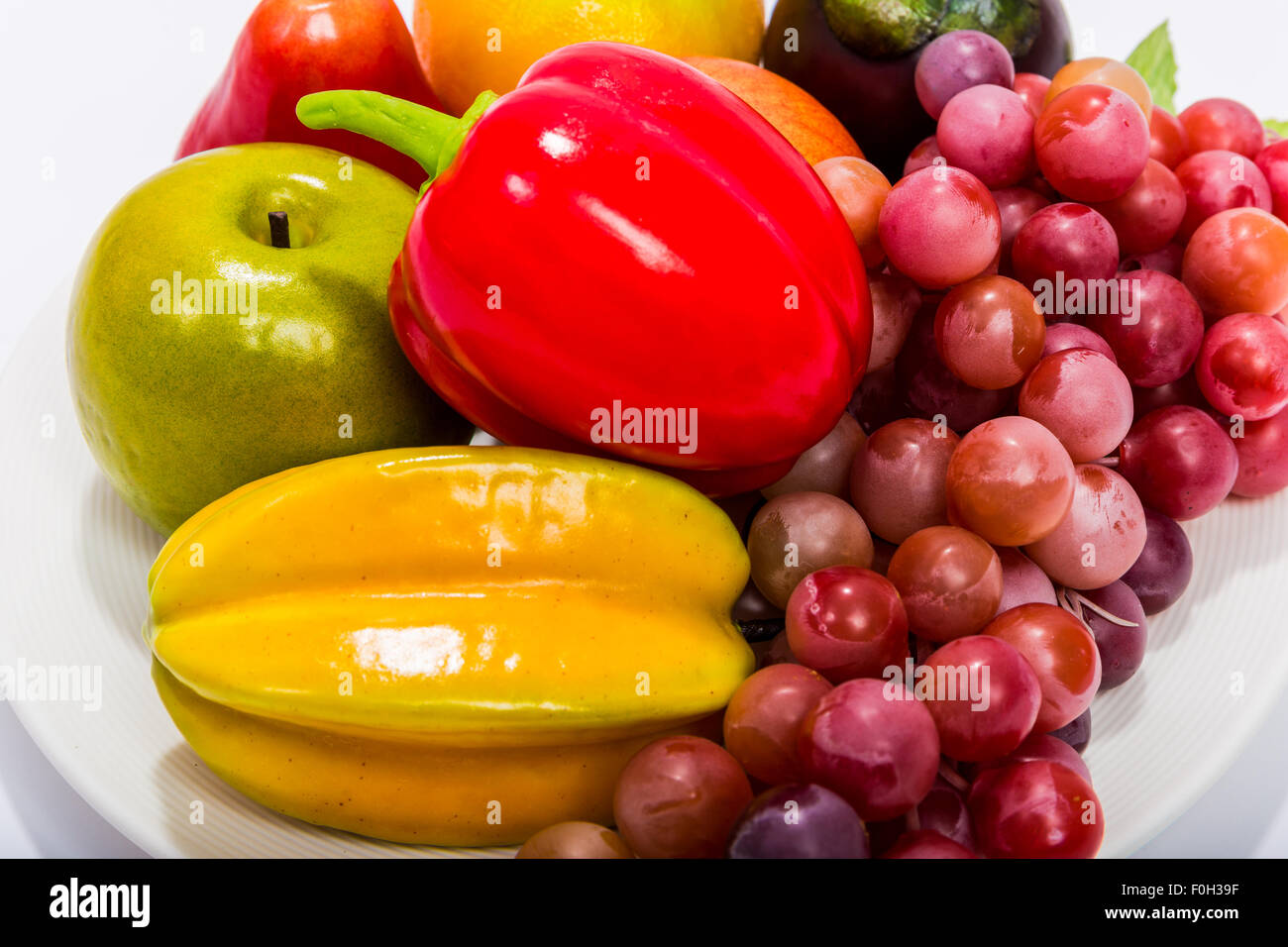 Various Kinds Of Fruits In Plate Isolated On White Background Stock various-kinds-of-fruits-in-plate-isolated-on-white-background-stock