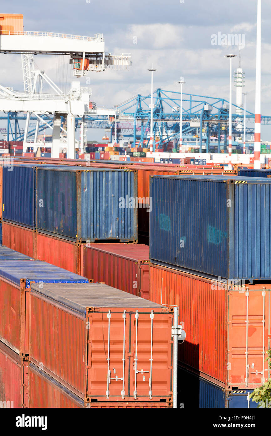 Cargo containers stacked at harbor Stock Photo - Alamy