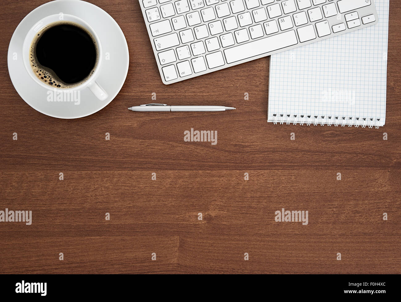 View from above with copy space, office table with notepad, keyboard ...