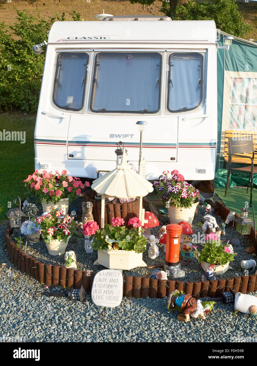 Designed garden in front of a caravan on campsite UK Stock Photo - Alamy