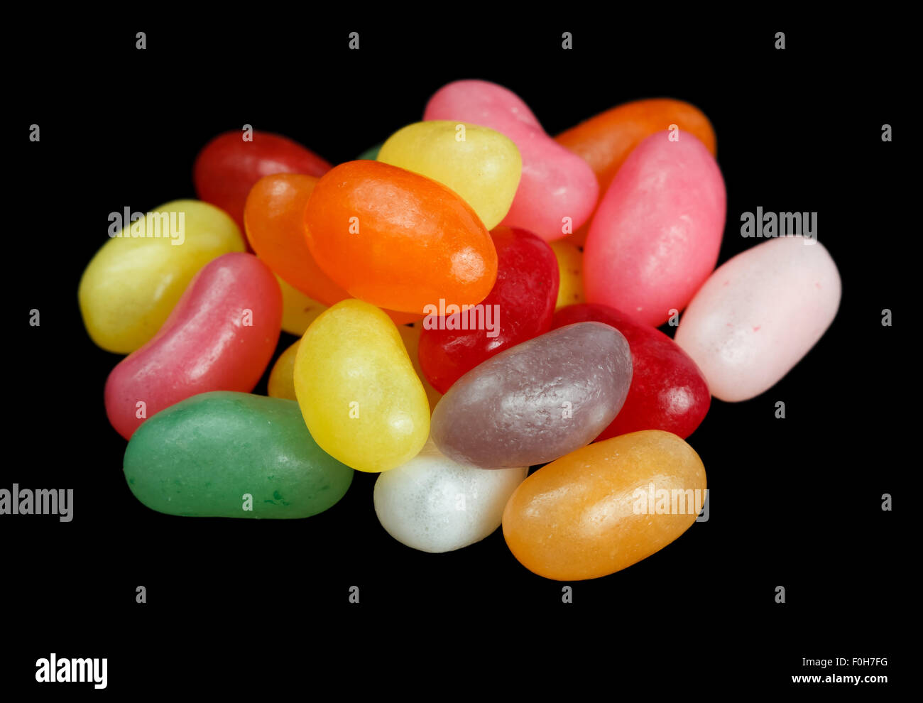 Pile of jelly beans isolated on black background Stock Photo - Alamy