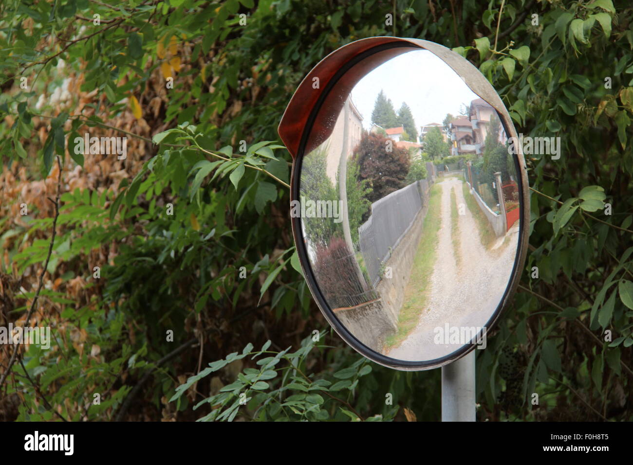 Security camera, Mirror road Traffic Italian culture Stock Photo - Alamy