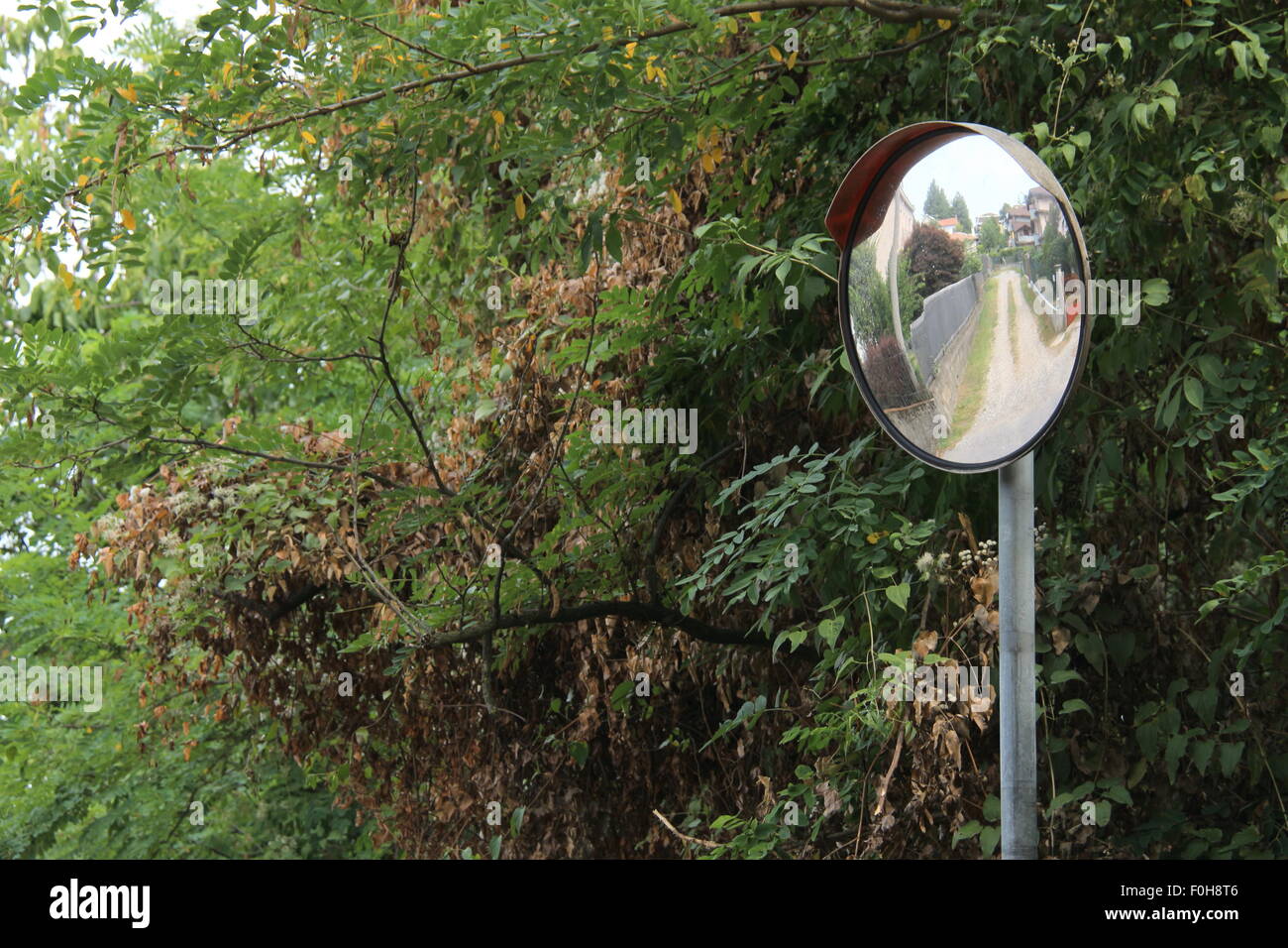 Security camera, Mirror road Traffic Italian culture Stock Photo - Alamy