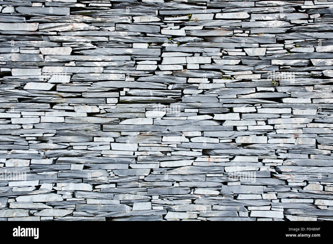 Hiker walks in the abandoned slate quarry in the Croesor area of ...