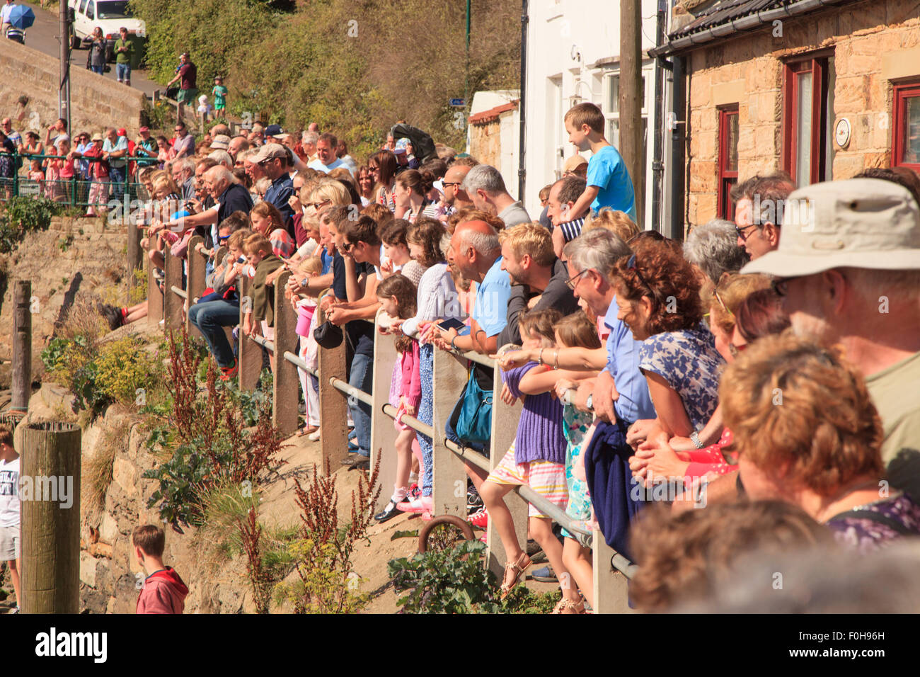 Staithes, UK. 15th Aug, 2015. Crowds along the edge of Roxby Beck ...