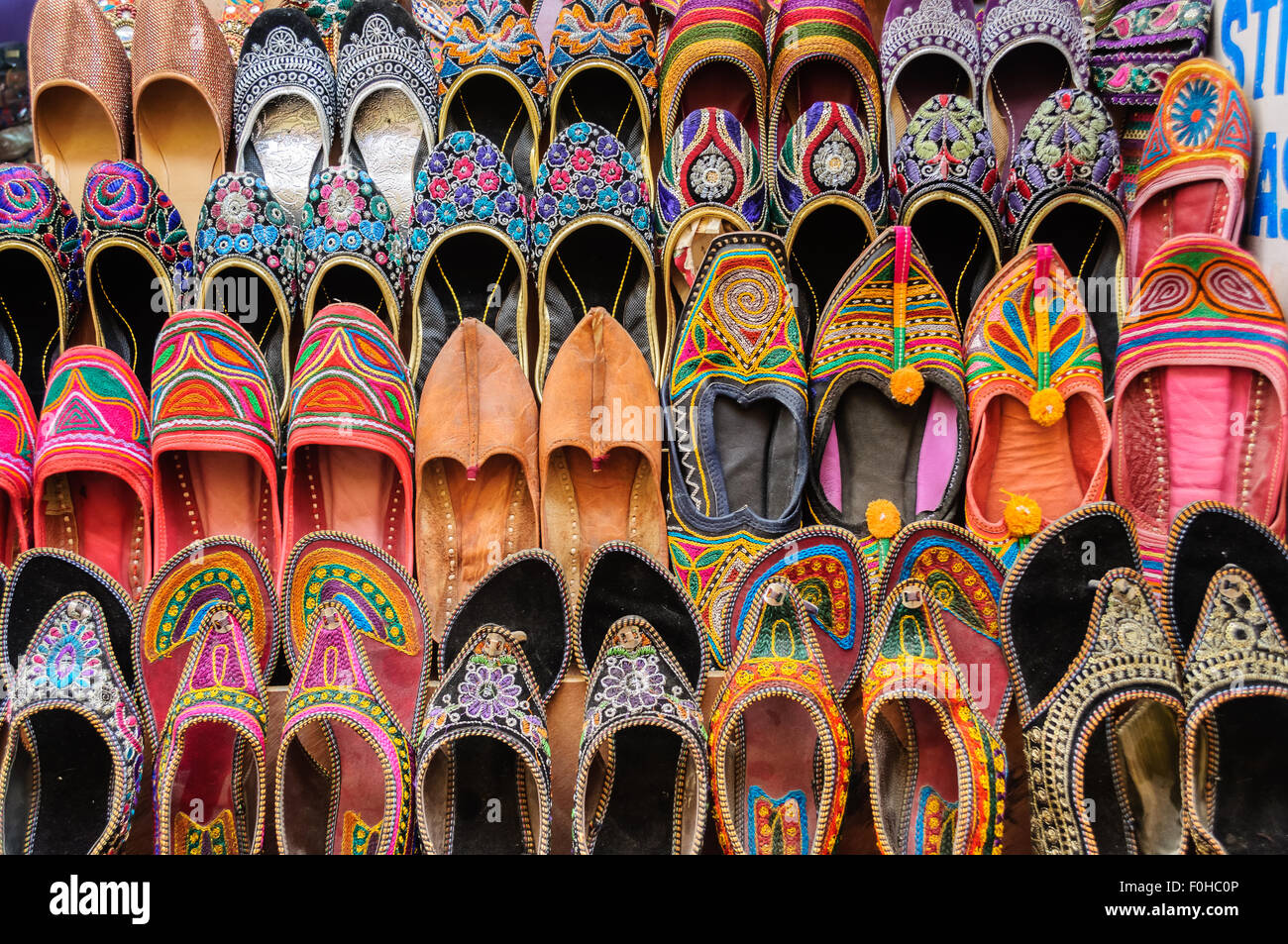 Collection of Jutti traditional colorful shoes of Rajasthan, India with ...