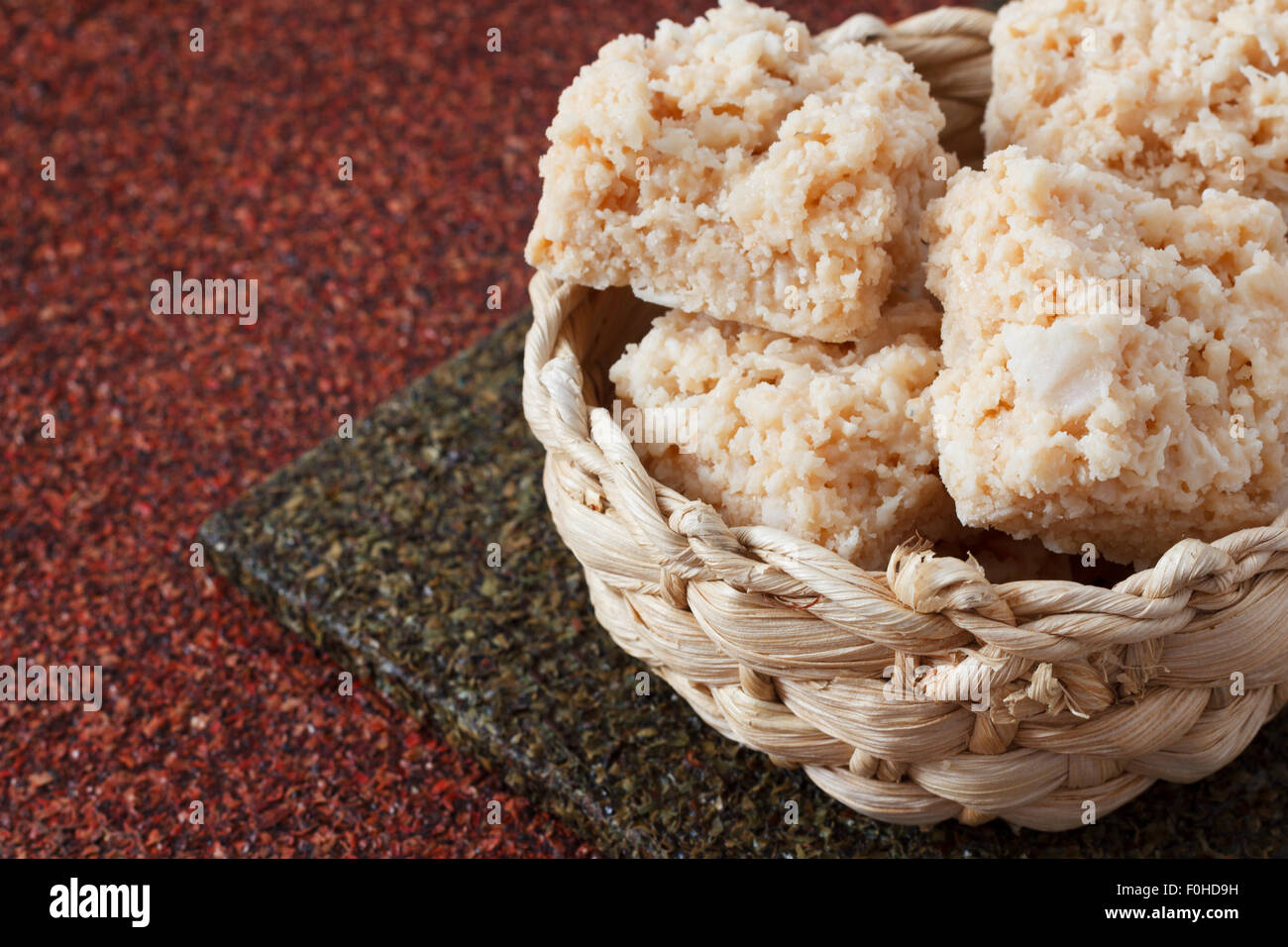 Coconut candy cocada in wicker basket. Selective focus Stock Photo - Alamy