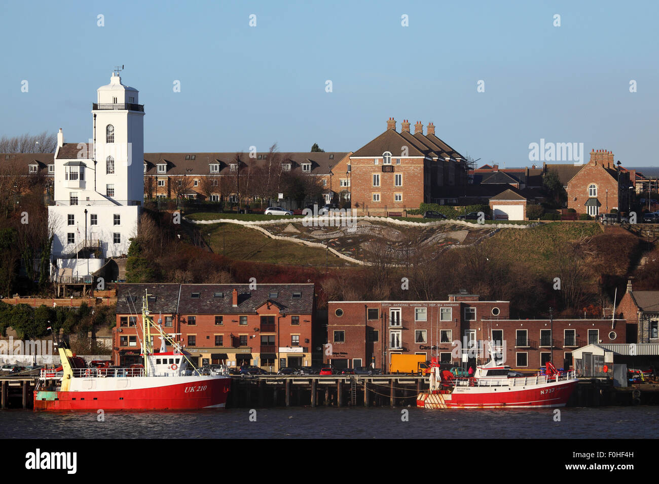 The nineteenth century High Light by the fishing harbour in North ...