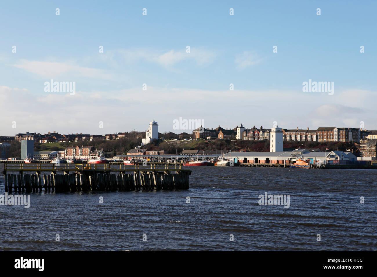 The High Light and Low Light towers stand by the fishing harbour in ...