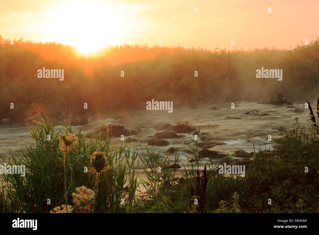 Dawn over Rushing river Stock Photo - Alamy