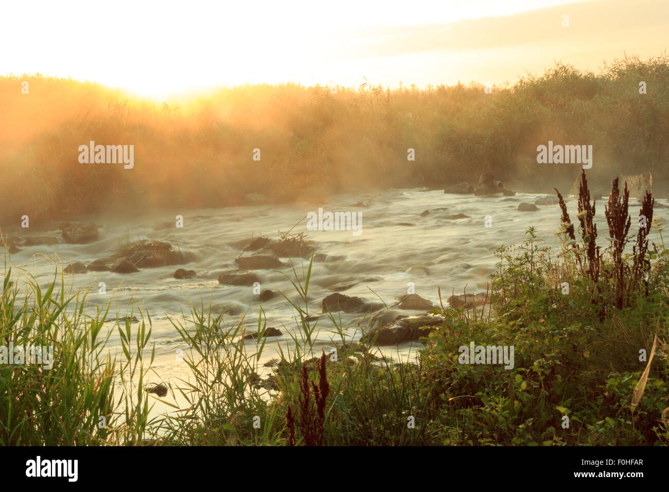 Dawn over Rushing river Stock Photo - Alamy