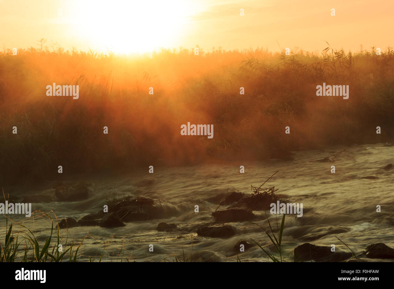 Dawn over Rushing river Stock Photo - Alamy