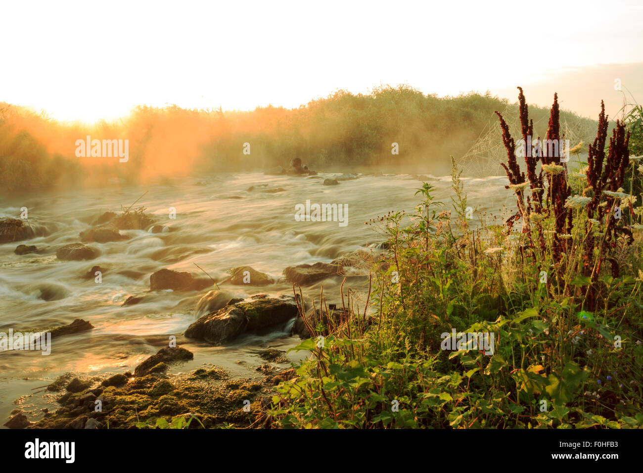 Dawn over Rushing river Stock Photo - Alamy