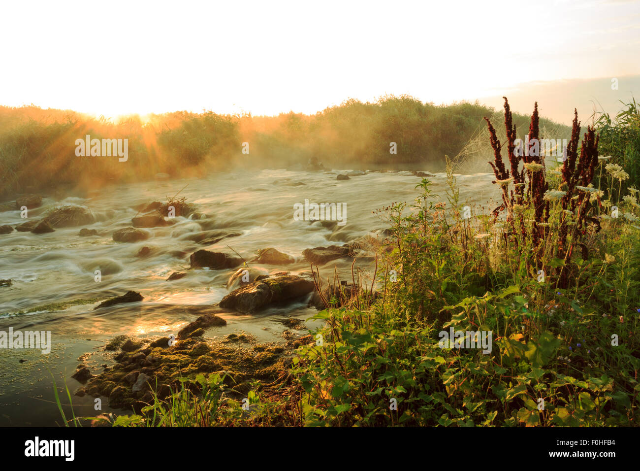Dawn over Rushing river Stock Photo - Alamy