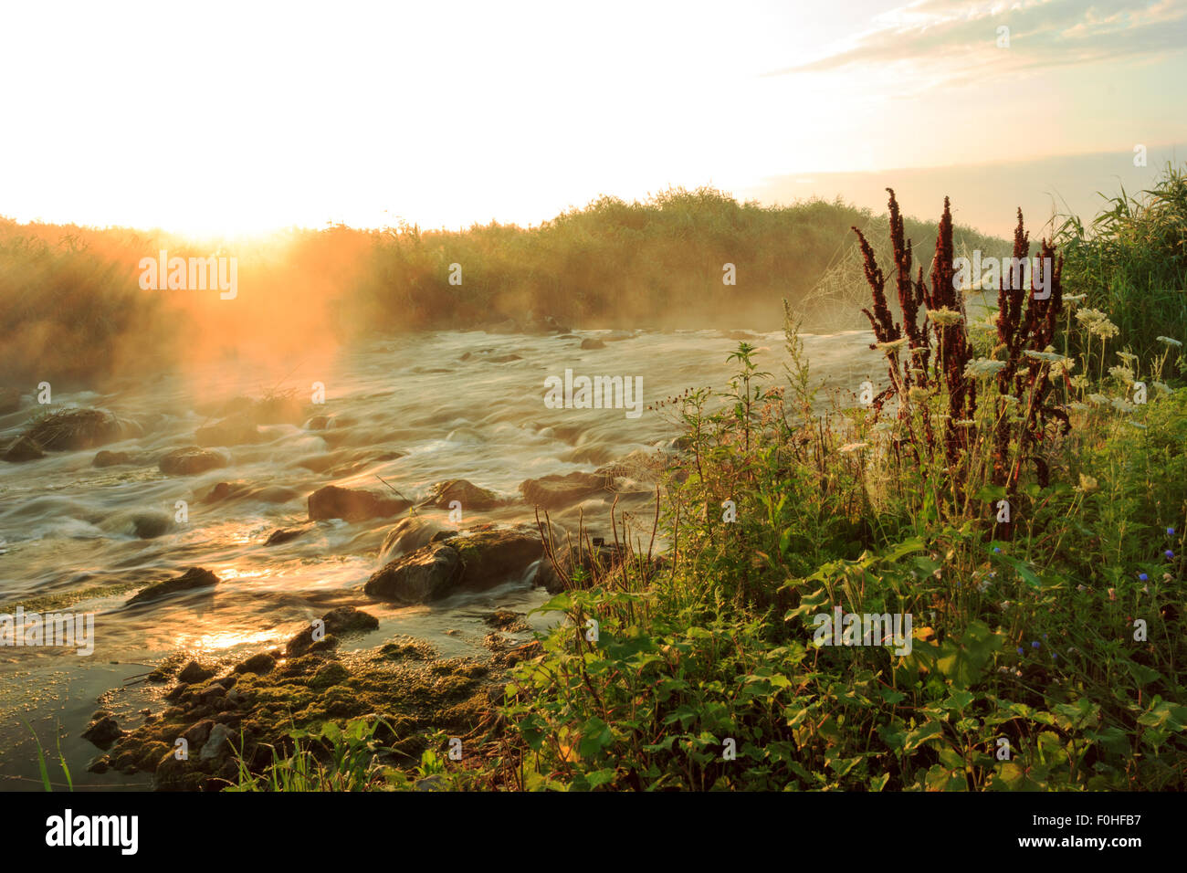 Dawn over Rushing river Stock Photo - Alamy