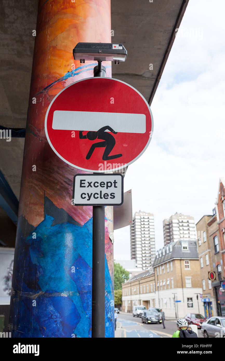 Clet Abraham puts stickers on street signs to alter their meaning Stock ...