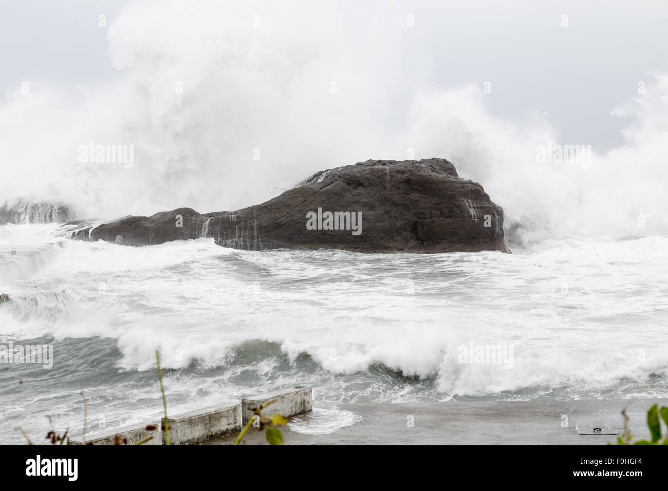 Stormy sea with waves crashing on rocks during Typhoon Souledor Stock ...