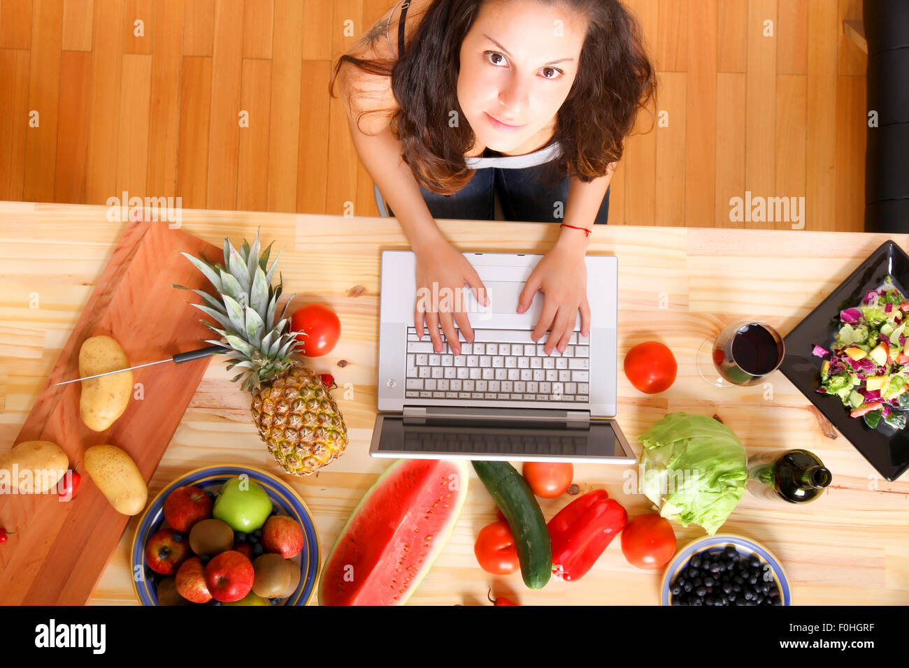 Cooking with some help from a Laptop Stock Photo - Alamy
