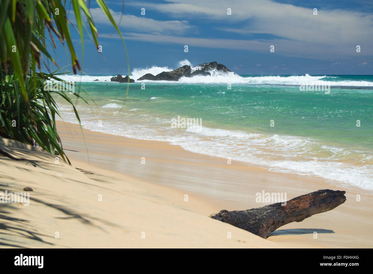 Waves collide with the rock located near Wijaya Beach, Sri lanka Stock ...