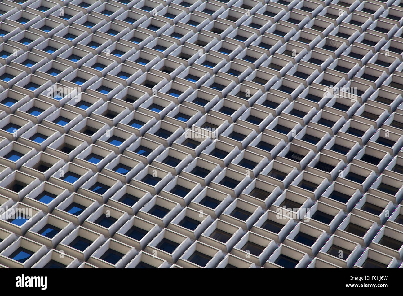 Square windows form a geometric pattern on a skyscraper facade in New ...