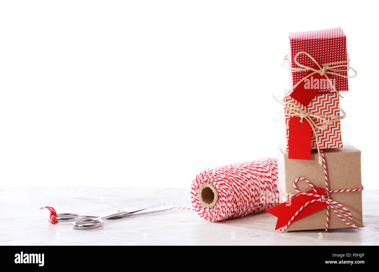 Handmade small boxes with scissors and spool on white background Stock ...