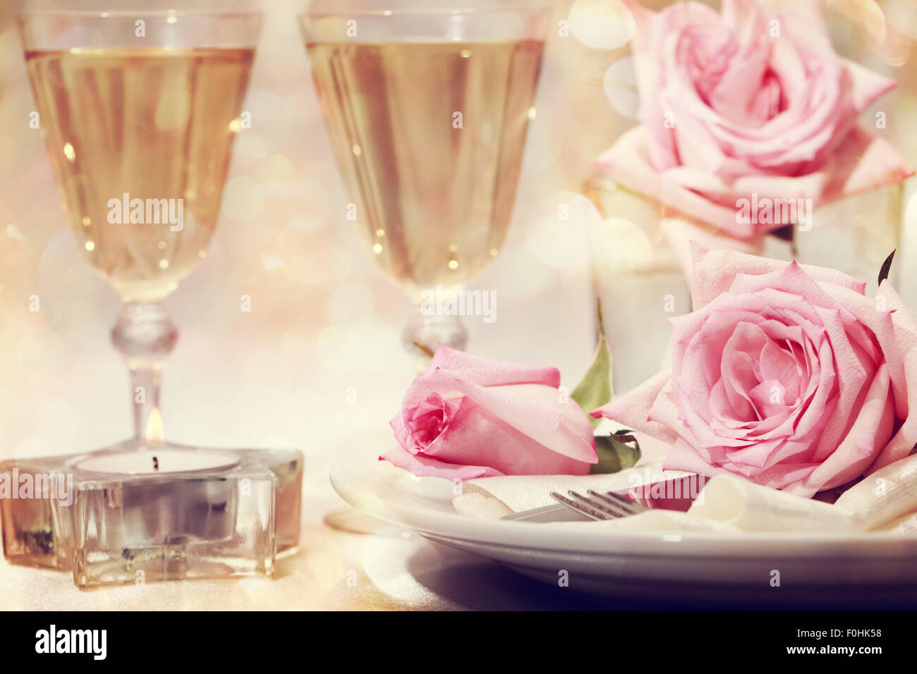 Decorated dinner table with beautiful pink roses Stock Photo - Alamy