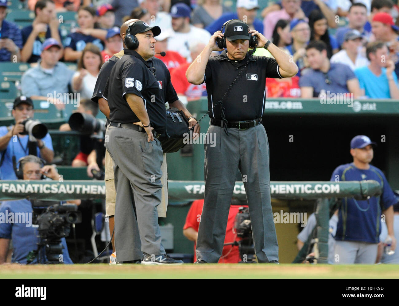 AUG 14, 2015: umpire Eric Cooper #56 review a play during an MLB game ...