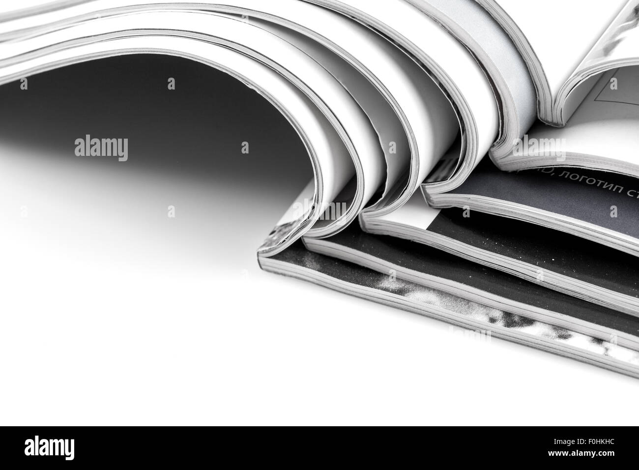 Stack of magazines on white background with reflection Stock Photo - Alamy