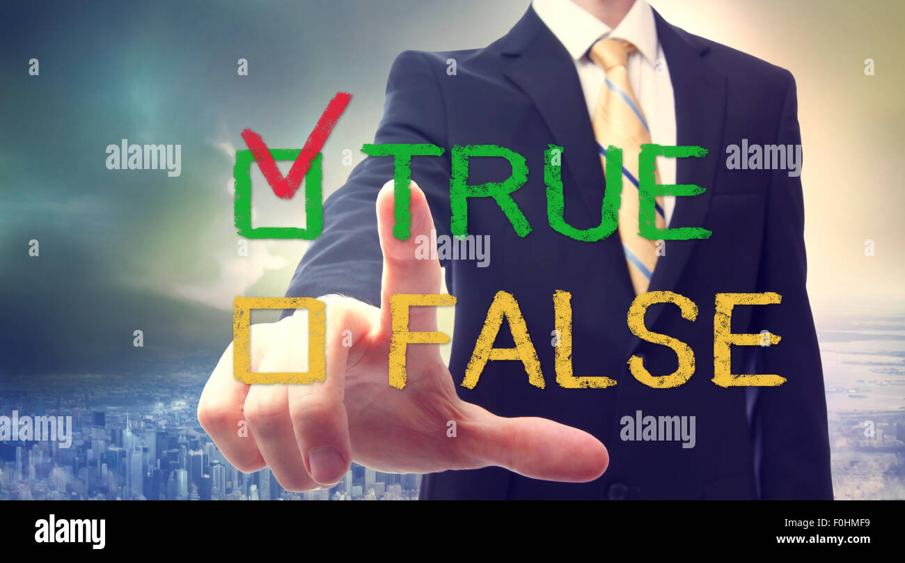 Businessman pointing at TRUE or FALSE checkbox Stock Photo - Alamy