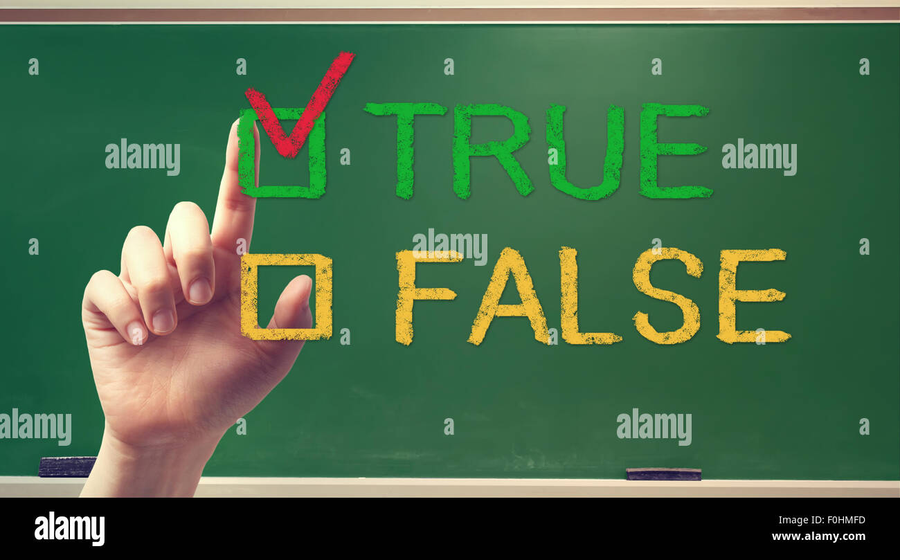 TRUE or FALSE checkbox with hand on green chalkboard Stock Photo - Alamy