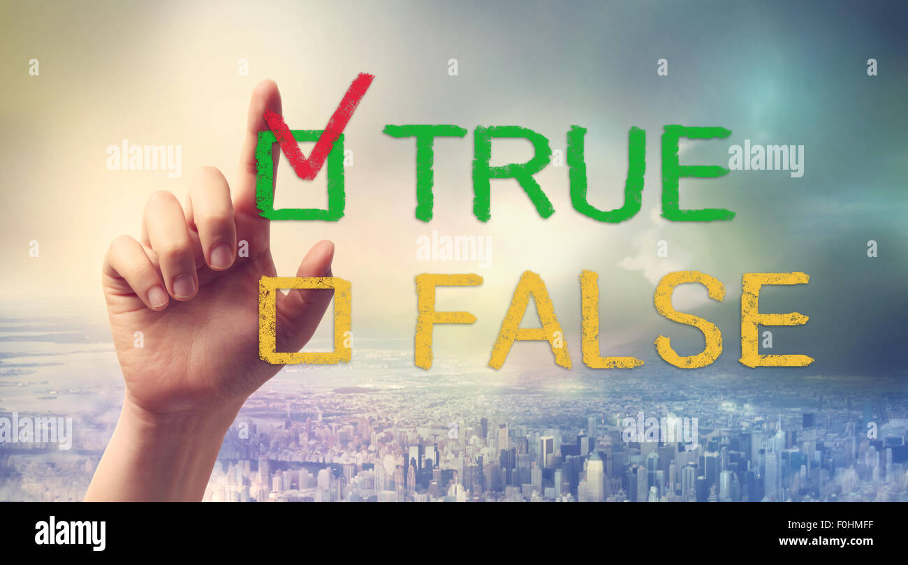 Hand pointing at TRUE or FALSE checkbox Stock Photo - Alamy