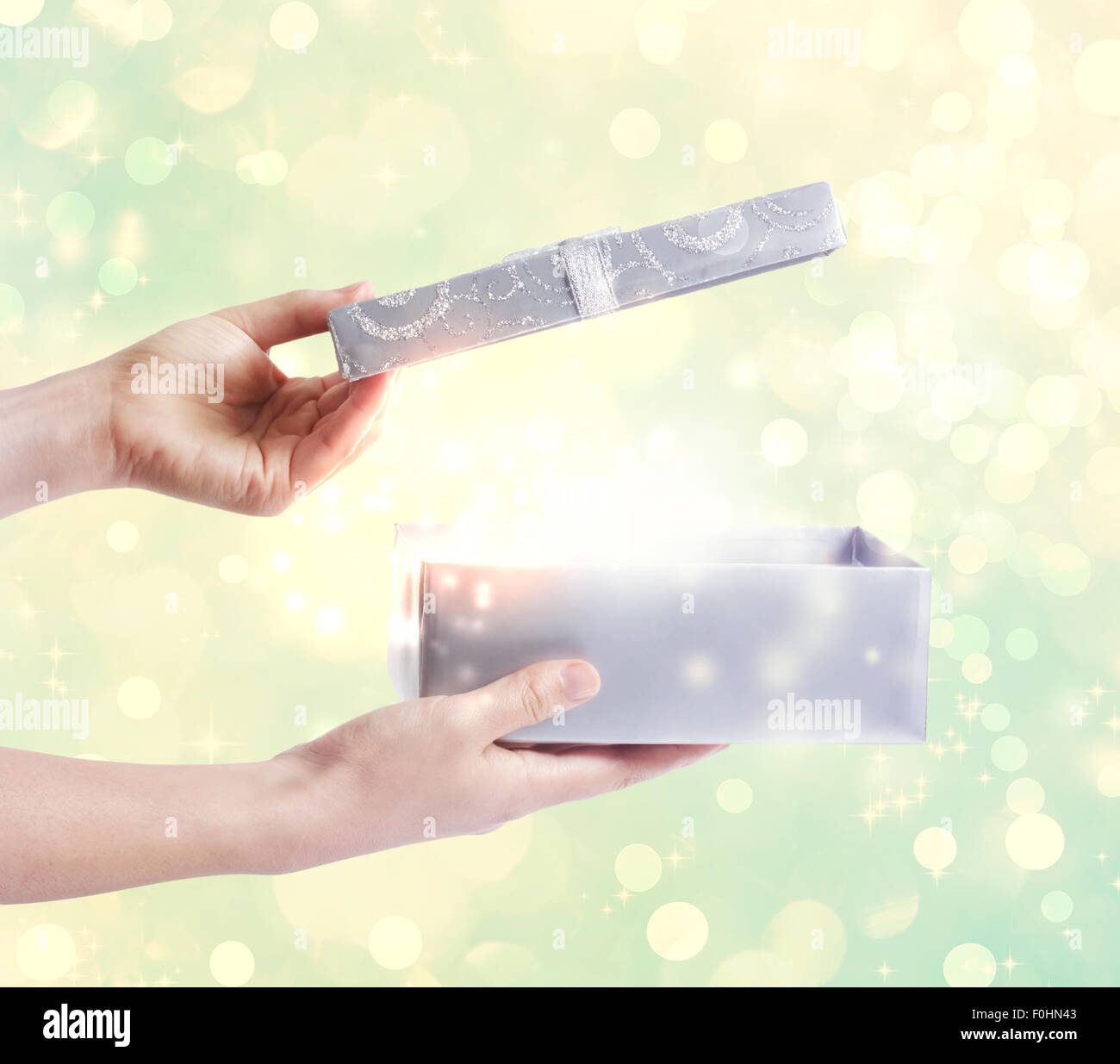 A magical glowing present box being opened Stock Photo - Alamy