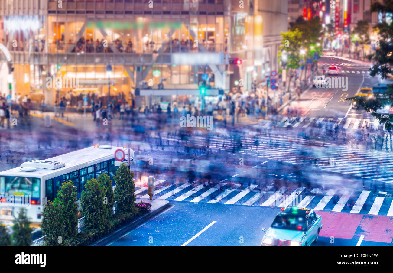 People and vehicles cross the famously busy Shibuya scramble ...