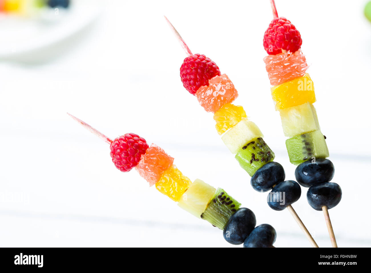 Fresh summer fruits on sticks Stock Photo - Alamy