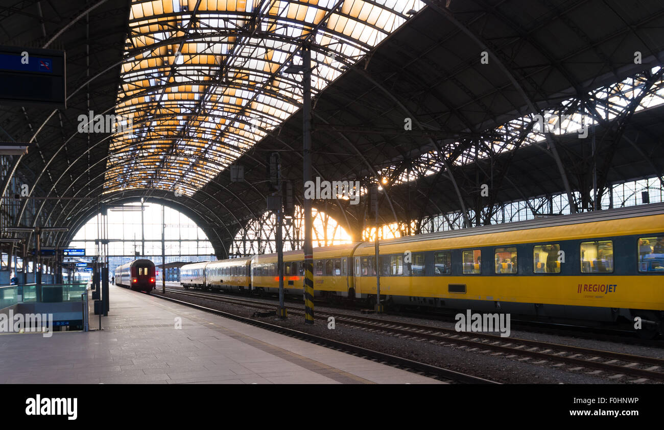 Yellow train waiting at a platform on the Prague main Railway station ...