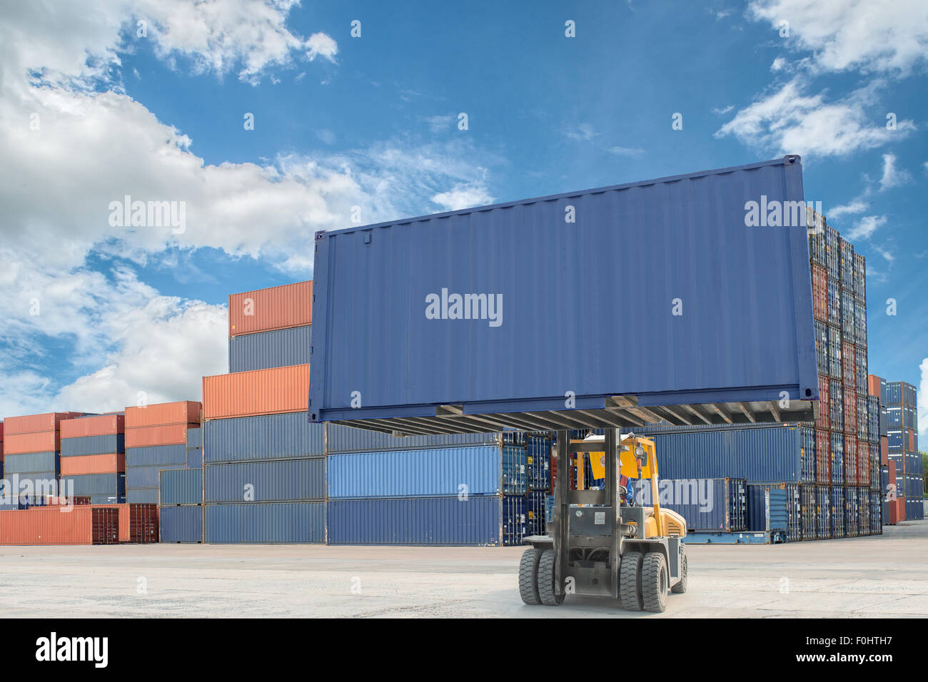 forklift handling container box loading to truck in import export ...