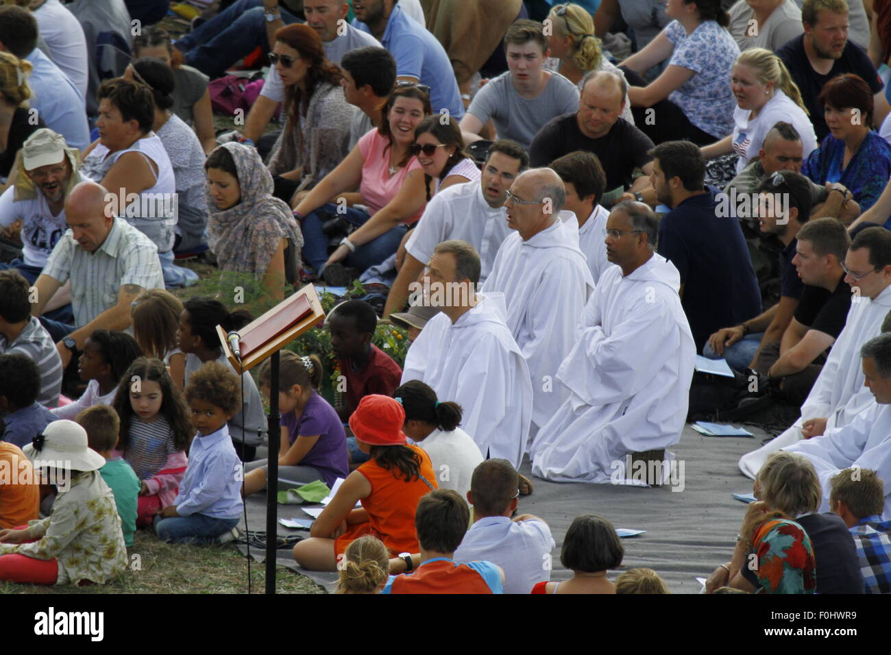 Taizé, France. 16th August 2015. The Brothers of Taizé sit in the ...