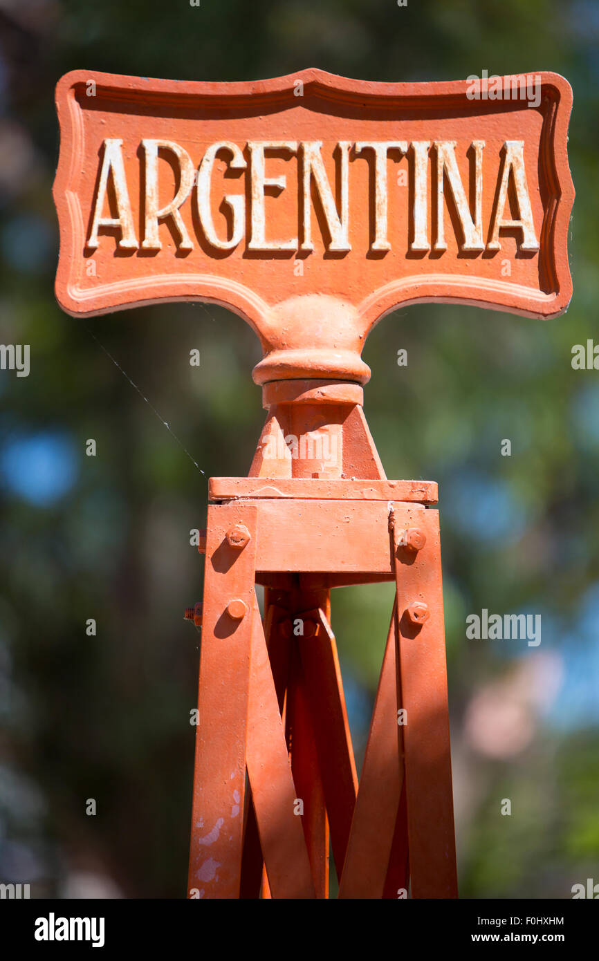 Late afternoon light on an old train sign post standing in the city of ...
