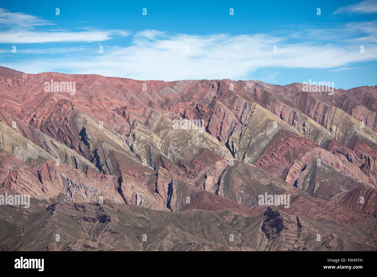 Mountain of fourteen colors, Quebrada de Humahuaca against a blue sky ...