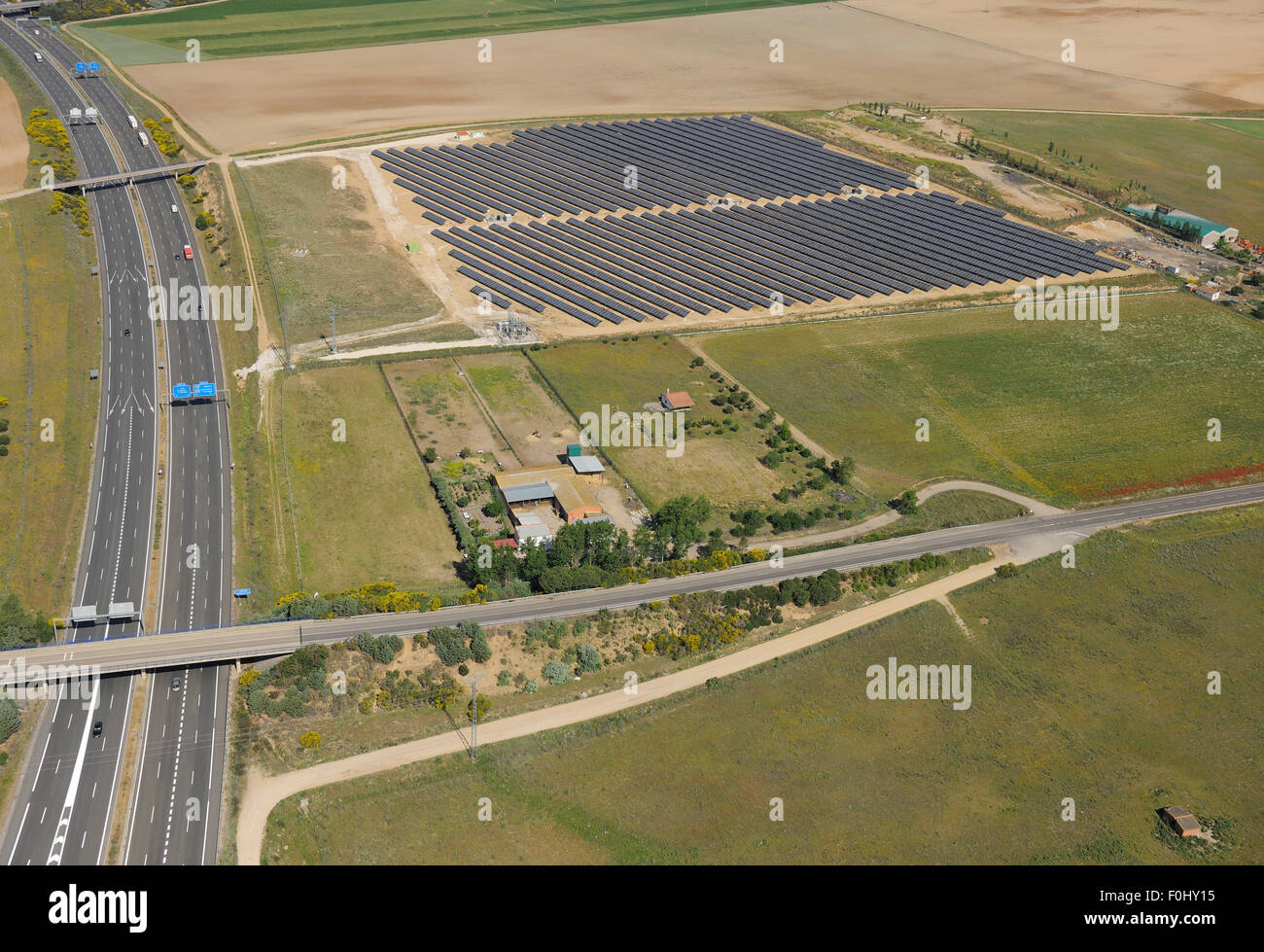 Aerial image of motorway next to solar energy power station, Salamanca ...