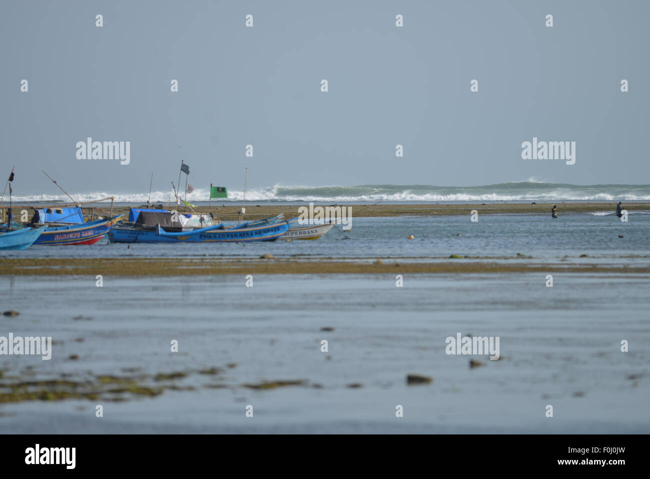 Surf scenes in the beach known as Orange Juice, in West Java, Indonesia ...