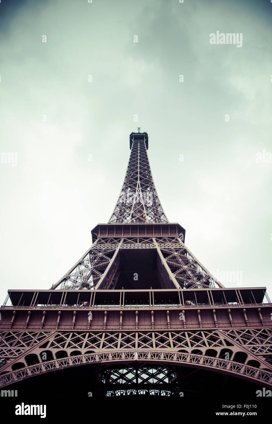 Low angle of the Eiffel Tower in Paris, France. Toned image Stock Photo ...