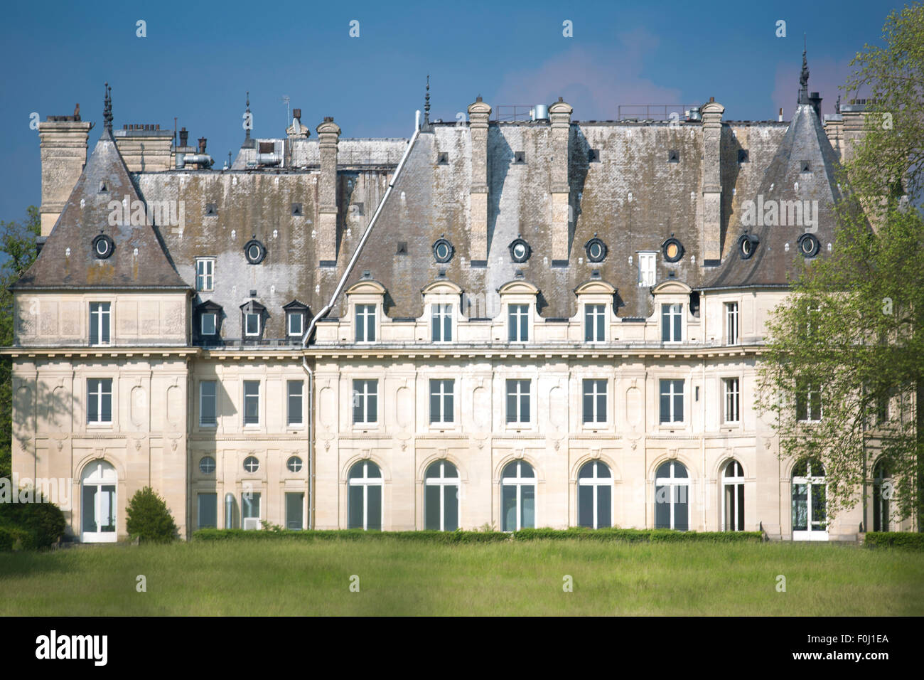 French castle in the north of france with blue garden and front garden ...