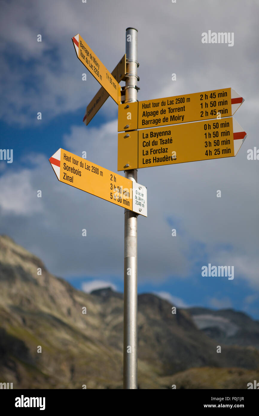 Road sign in the mountains of the canton of Valais, various signs with ...