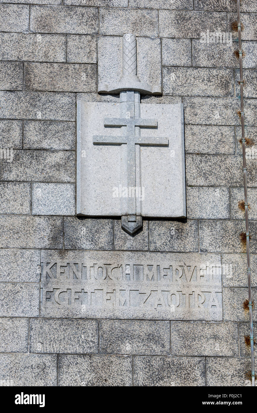 Pen Hir on which stands a monument in the form of a cross with a stone ...
