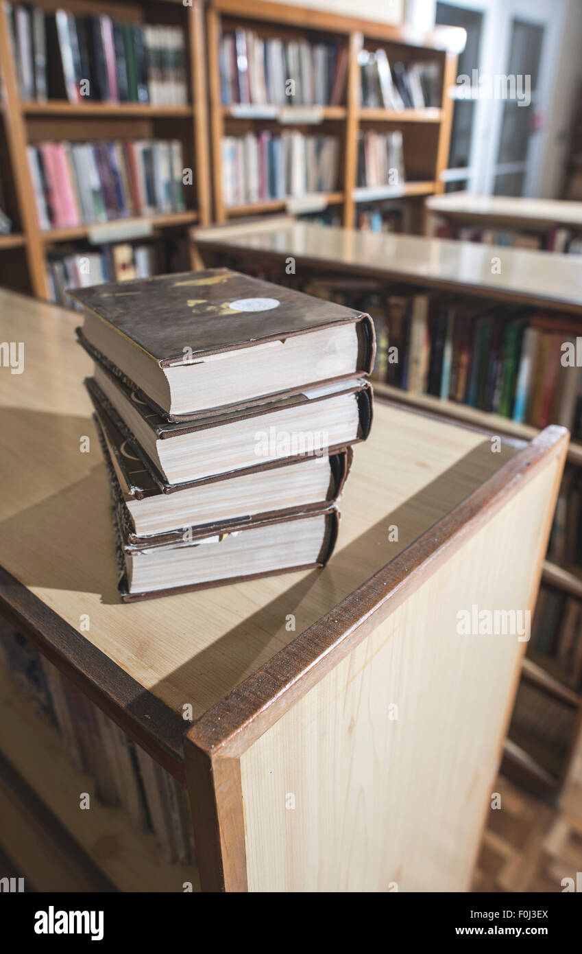 Old books in a vintage library shelfs Stock Photo - Alamy