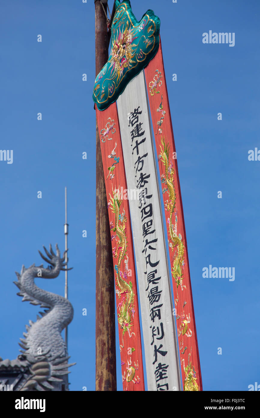 Religious vertical flag and a dragon in a temple in Shanghai, China ...